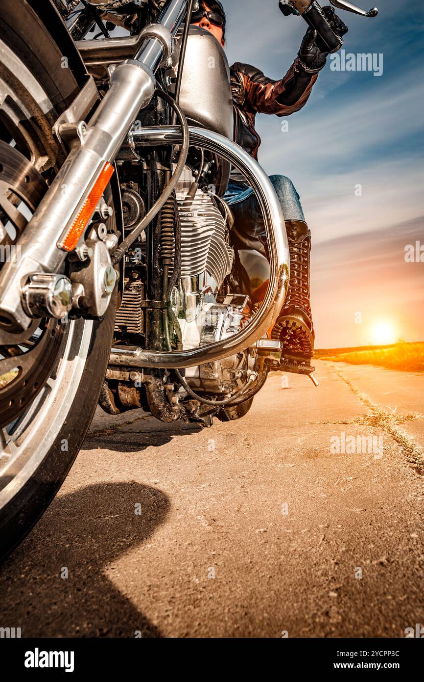 Biker girl riding on a motorcycle Stock Photo - Alamy