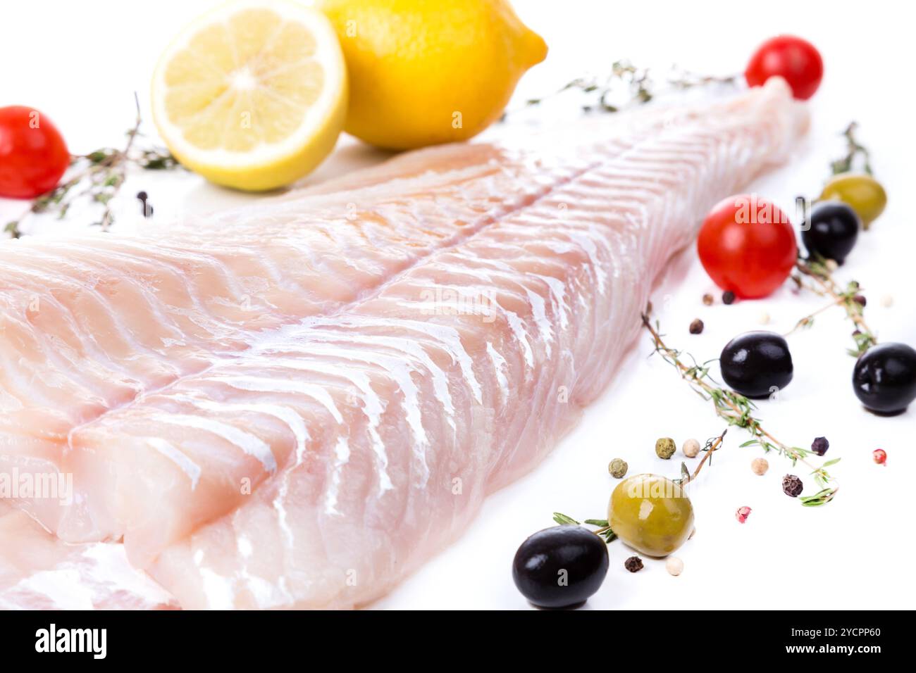 Uncooked raw fillet of cod with serving spices Stock Photo - Alamy
