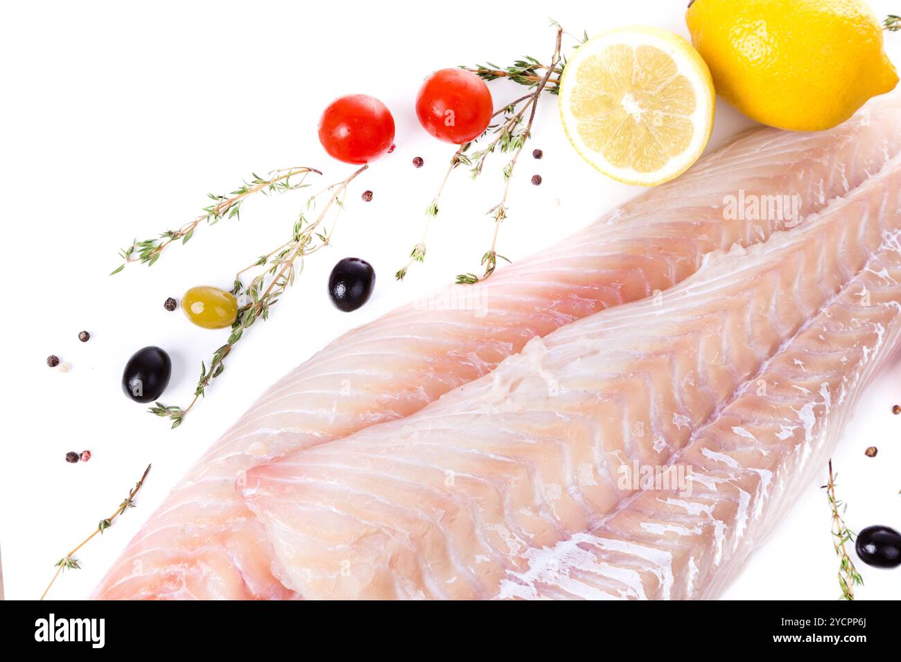 Uncooked raw fillet of cod with serving spices Stock Photo - Alamy
