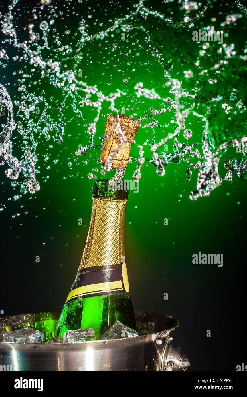 Bottle of champagne with splash Stock Photo - Alamy