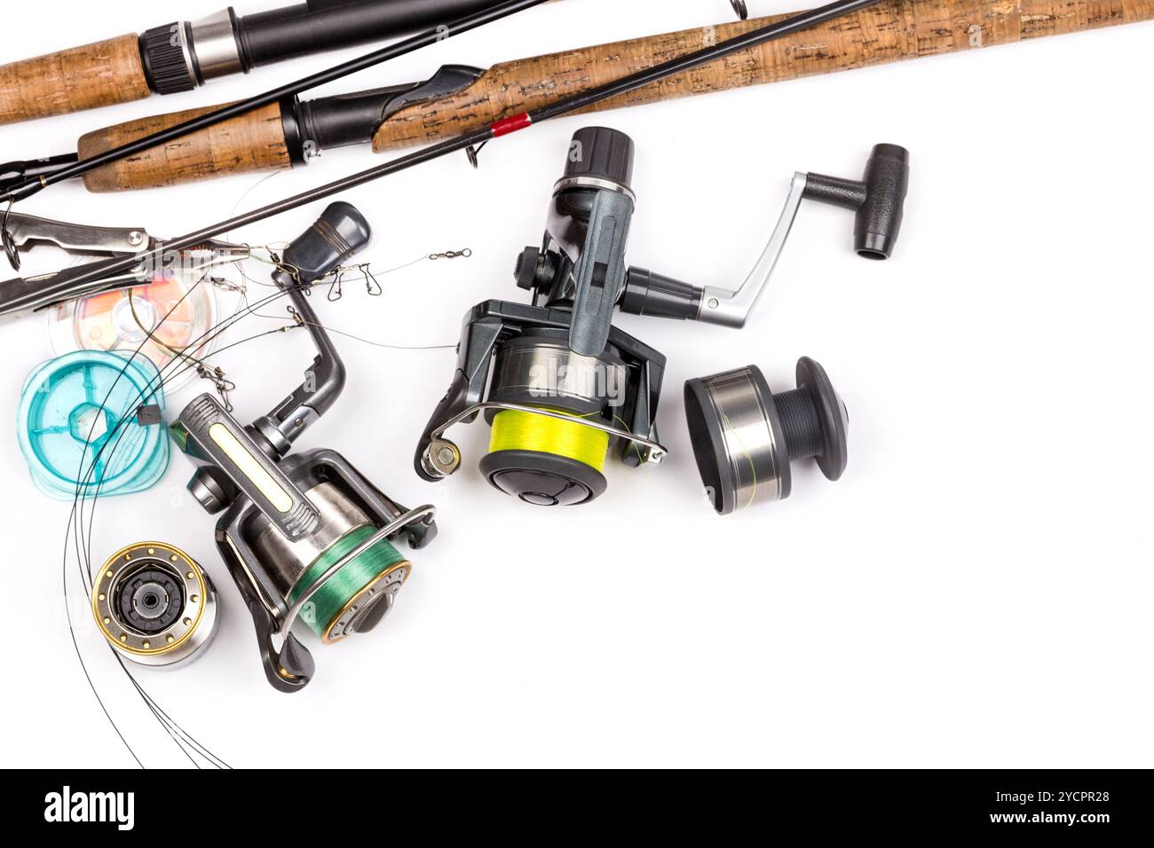 different fishing tackles - rod, reel, line and lures on white ...