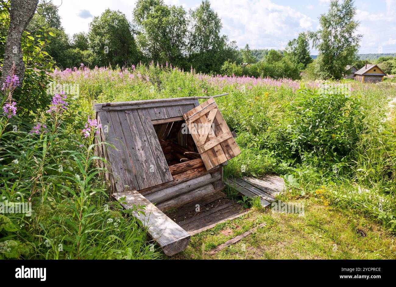 Old village wooden water well in summer day Stock Photo - Alamy