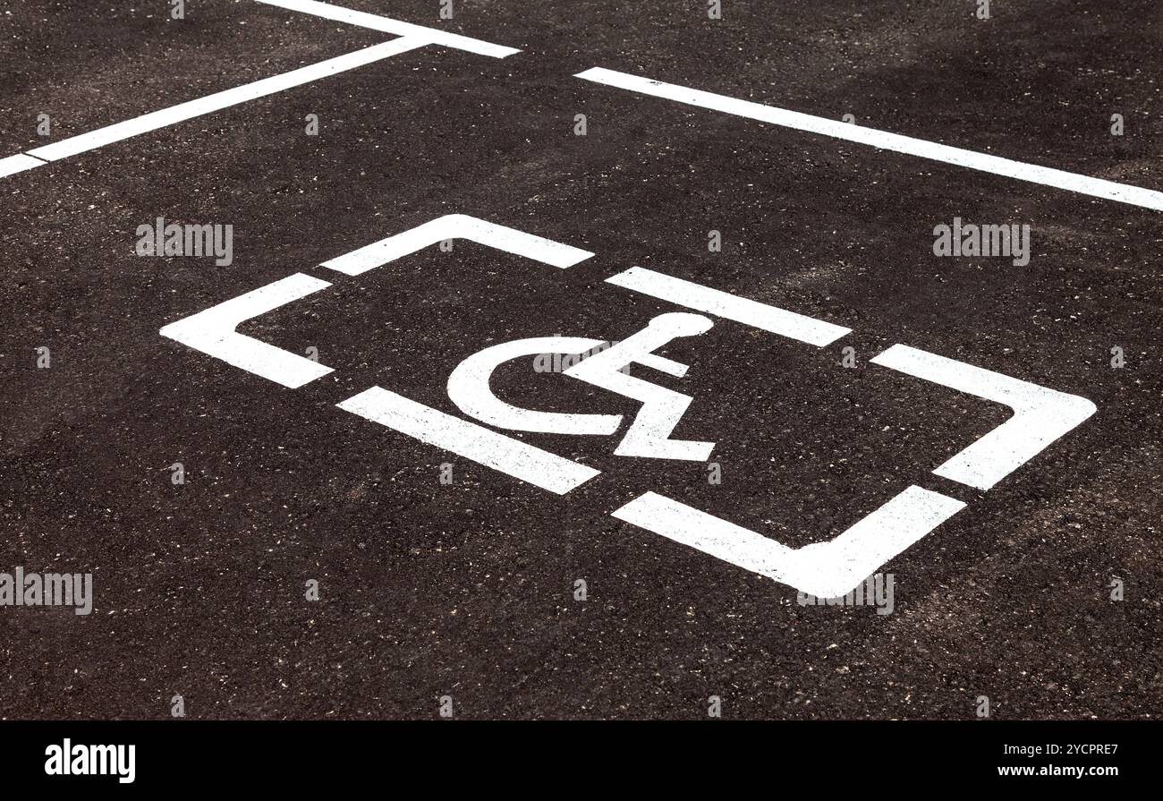 Parking places with handicapped or disabled signs and marking lines on ...