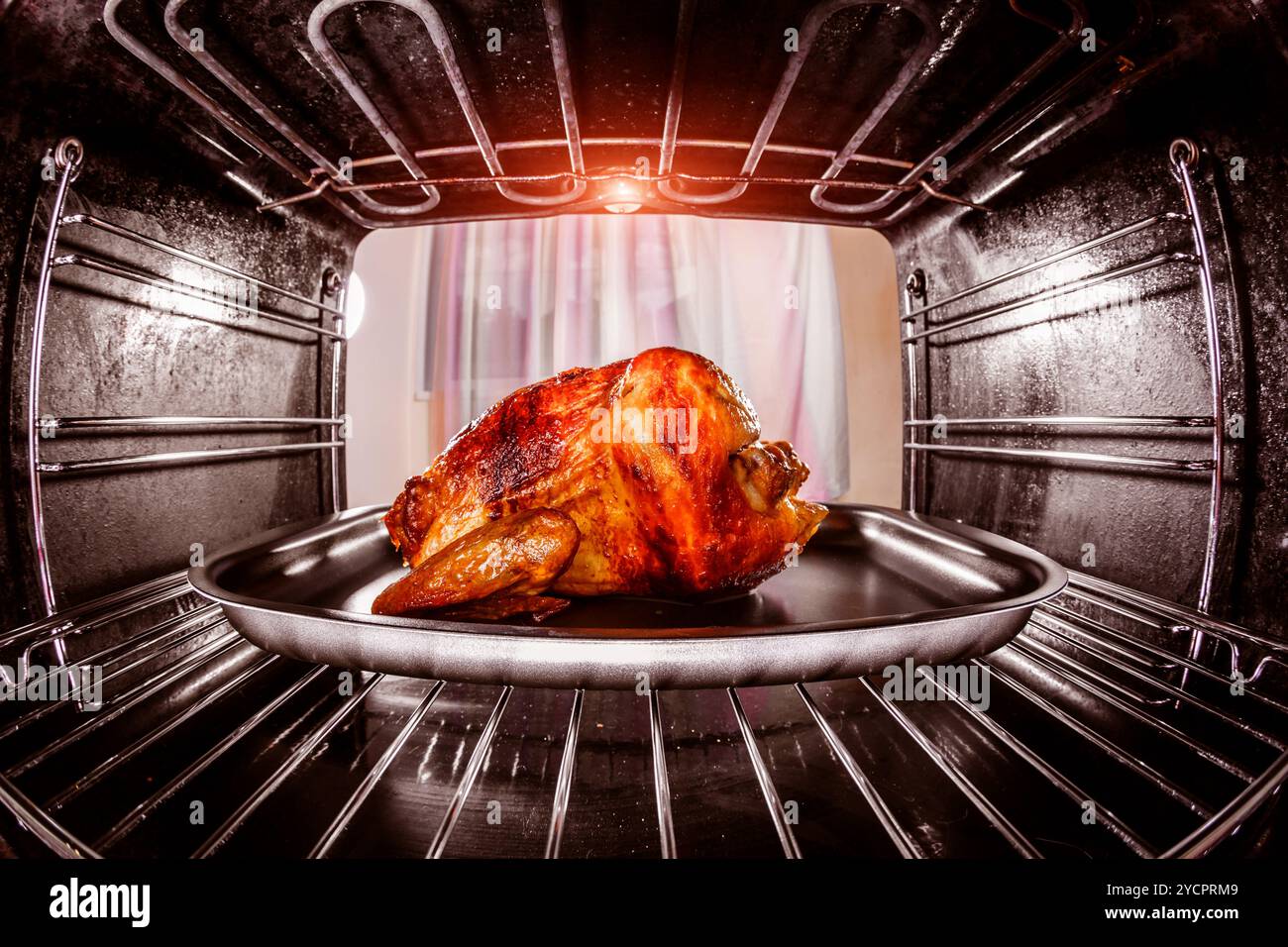 Roast chicken in the oven, view from the inside of the oven. Cooking in ...