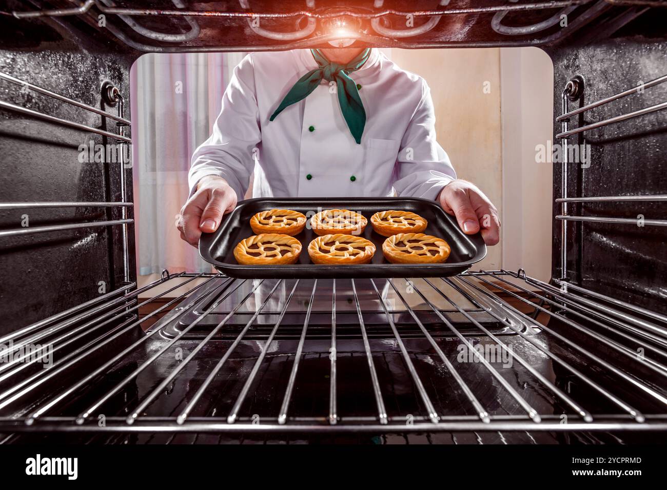 Chef cooking in the oven Stock Photo - Alamy