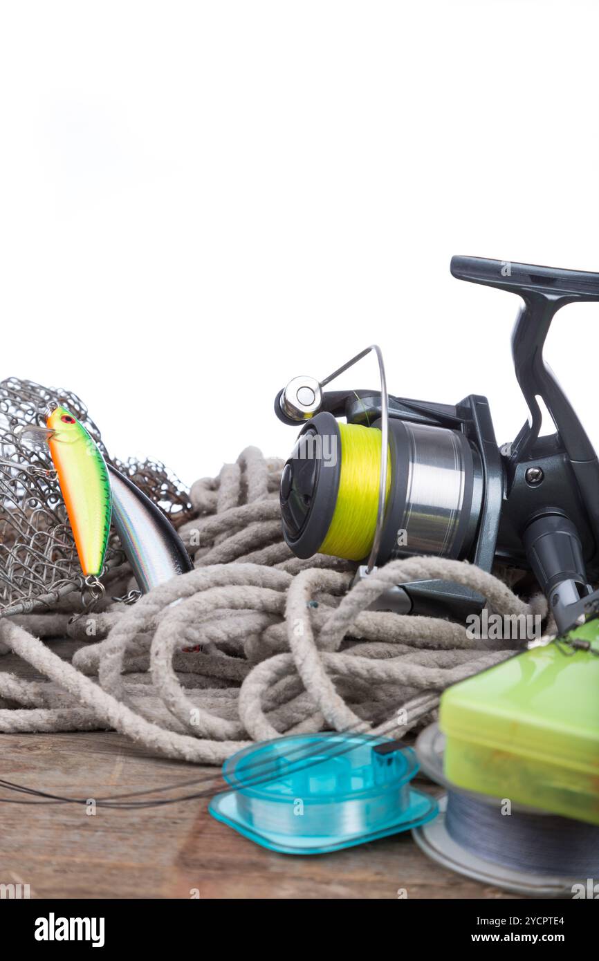 Fishing tackles on board and cord Stock Photo - Alamy