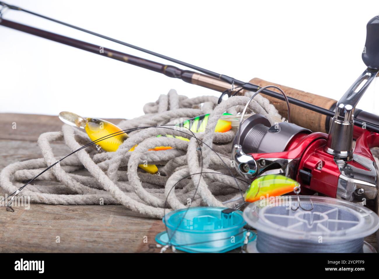 Fishing tackles on board with white background Stock Photo - Alamy