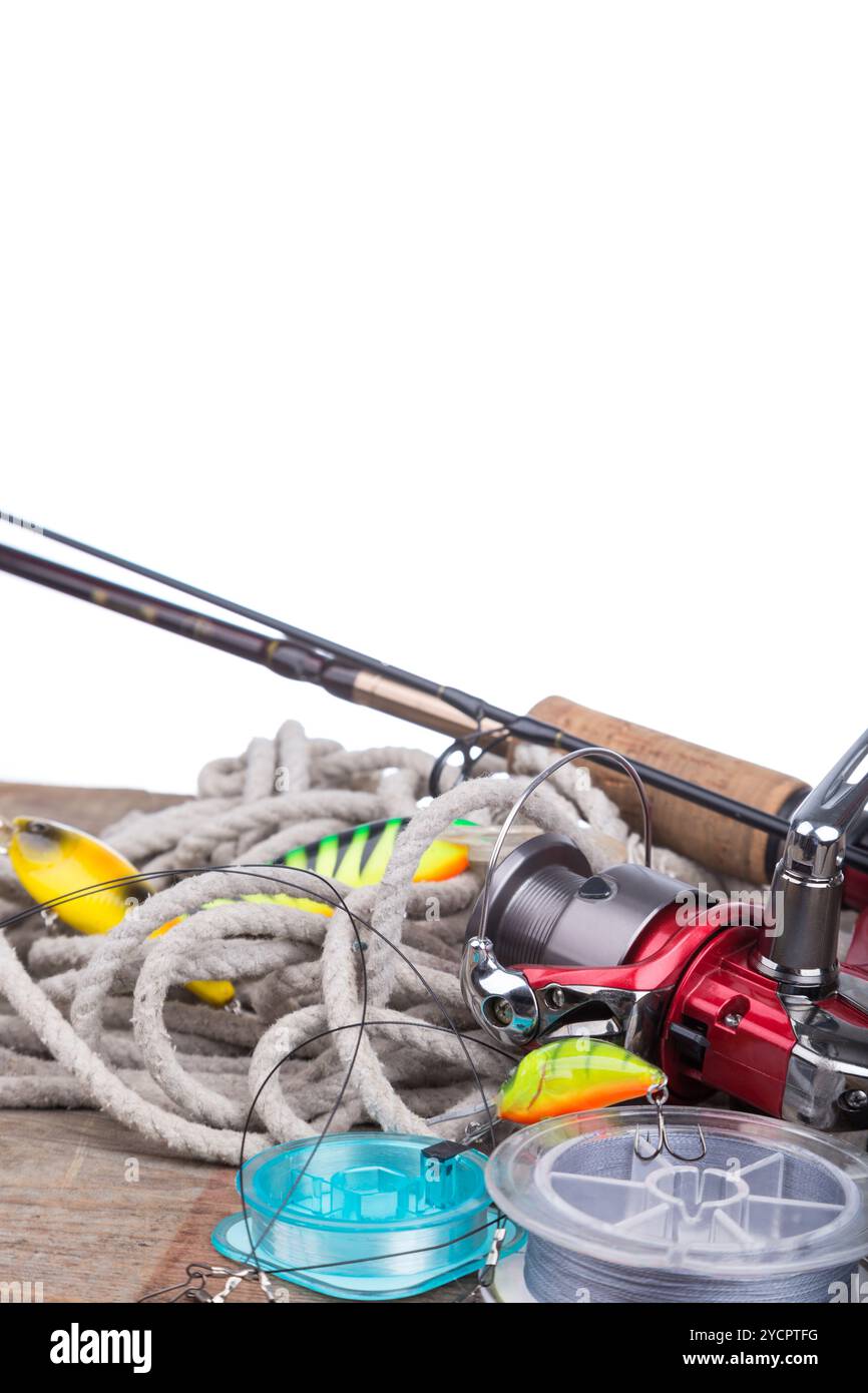 Fishing tackles on board with white background Stock Photo - Alamy