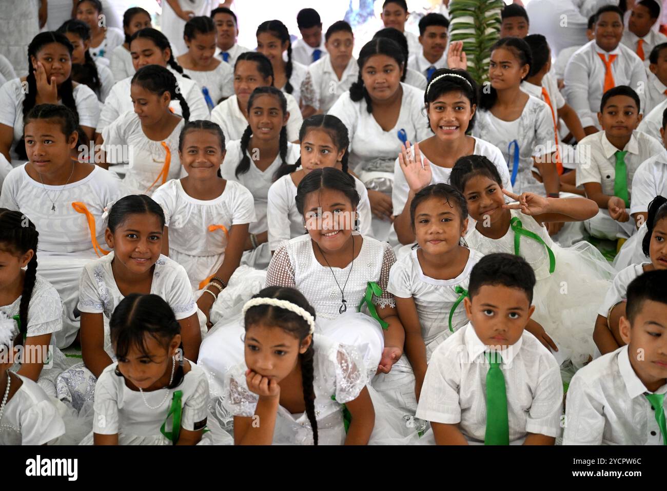 Children await the arrival of King Charles III and Queen Camilla at ...