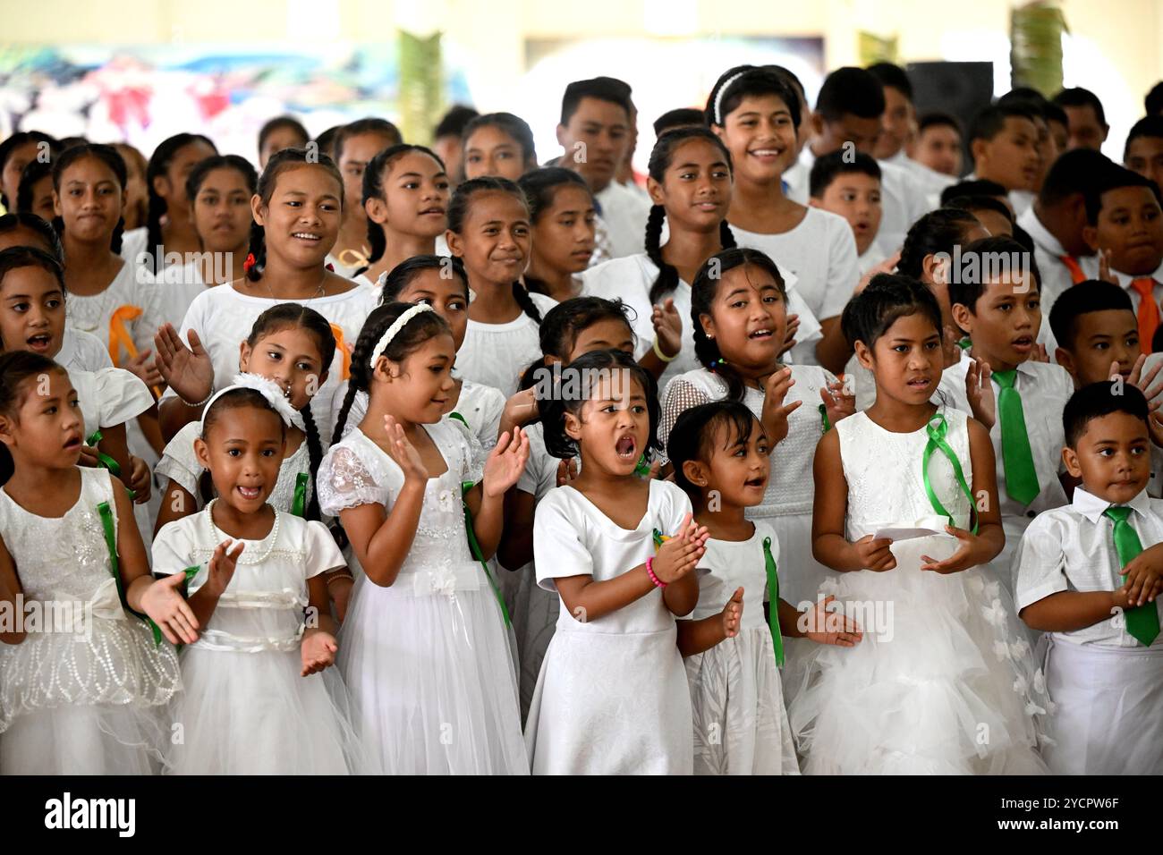 Children await the arrival of King Charles III and Queen Camilla at ...
