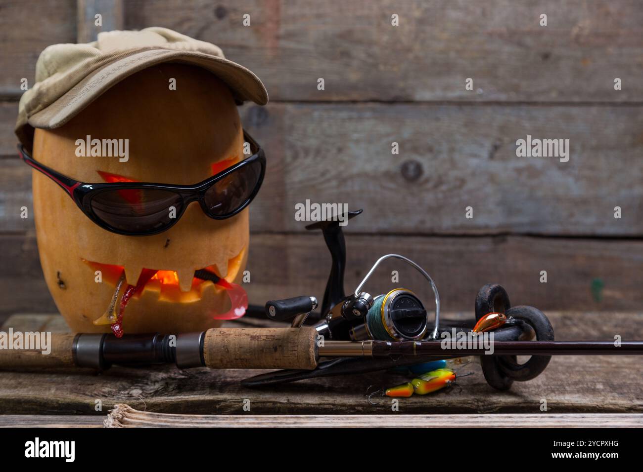 Halloween pumpkin head with fishing tackles Stock Photo - Alamy