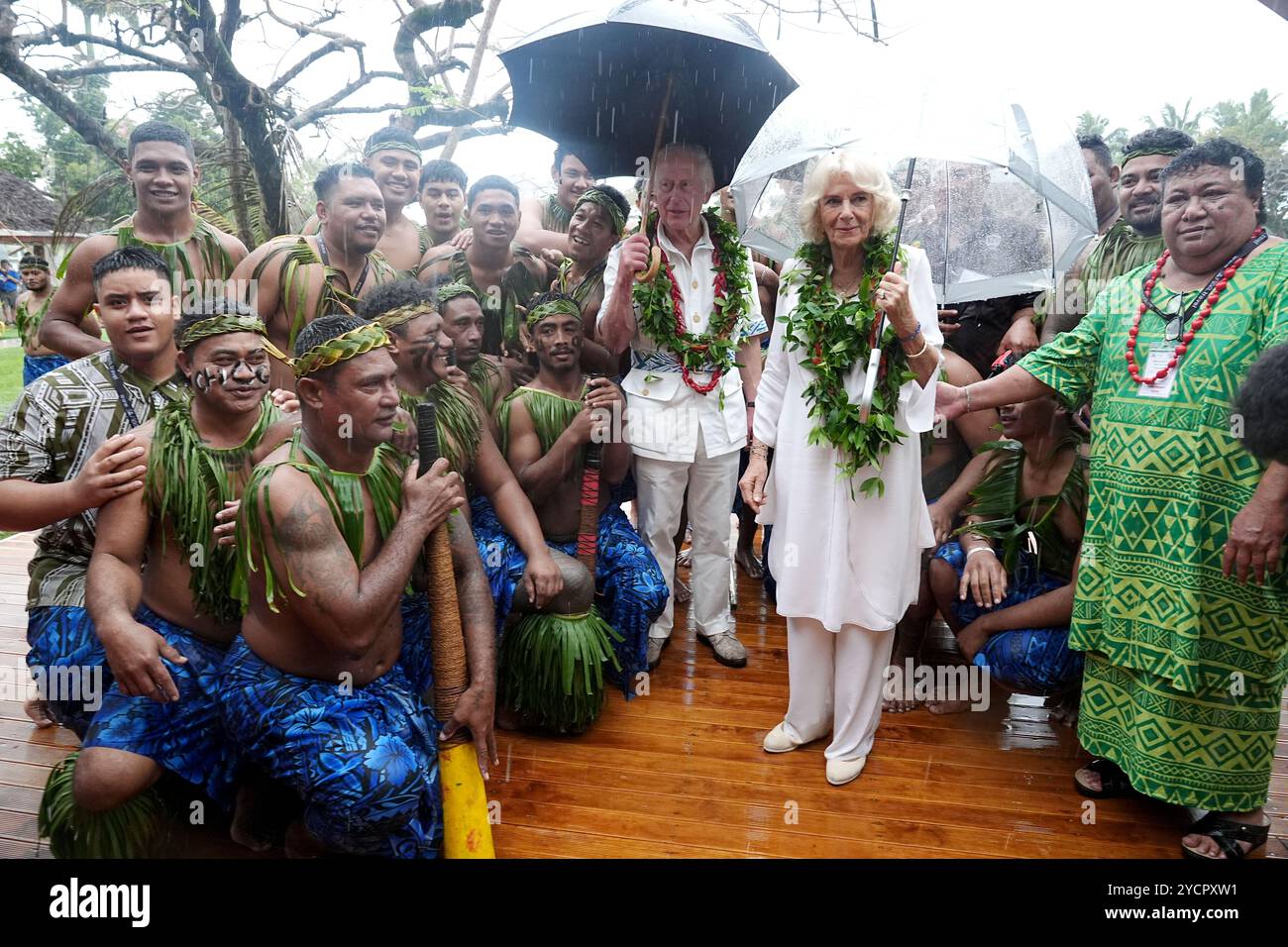 King Charles and Queen Camilla with members of a cricket team during a ...