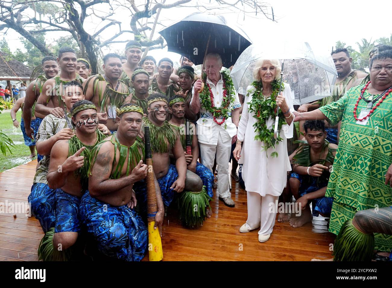 King Charles and Queen Camilla with members of a cricket team during a ...