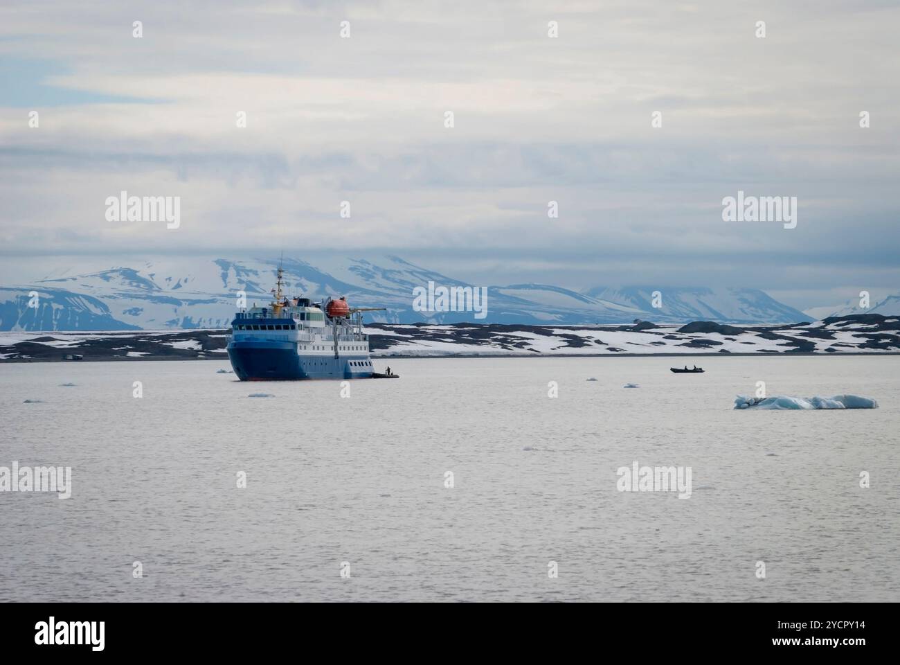 Ship sailing between icebergs in the arctic sea in Svalbard Stock Photo ...