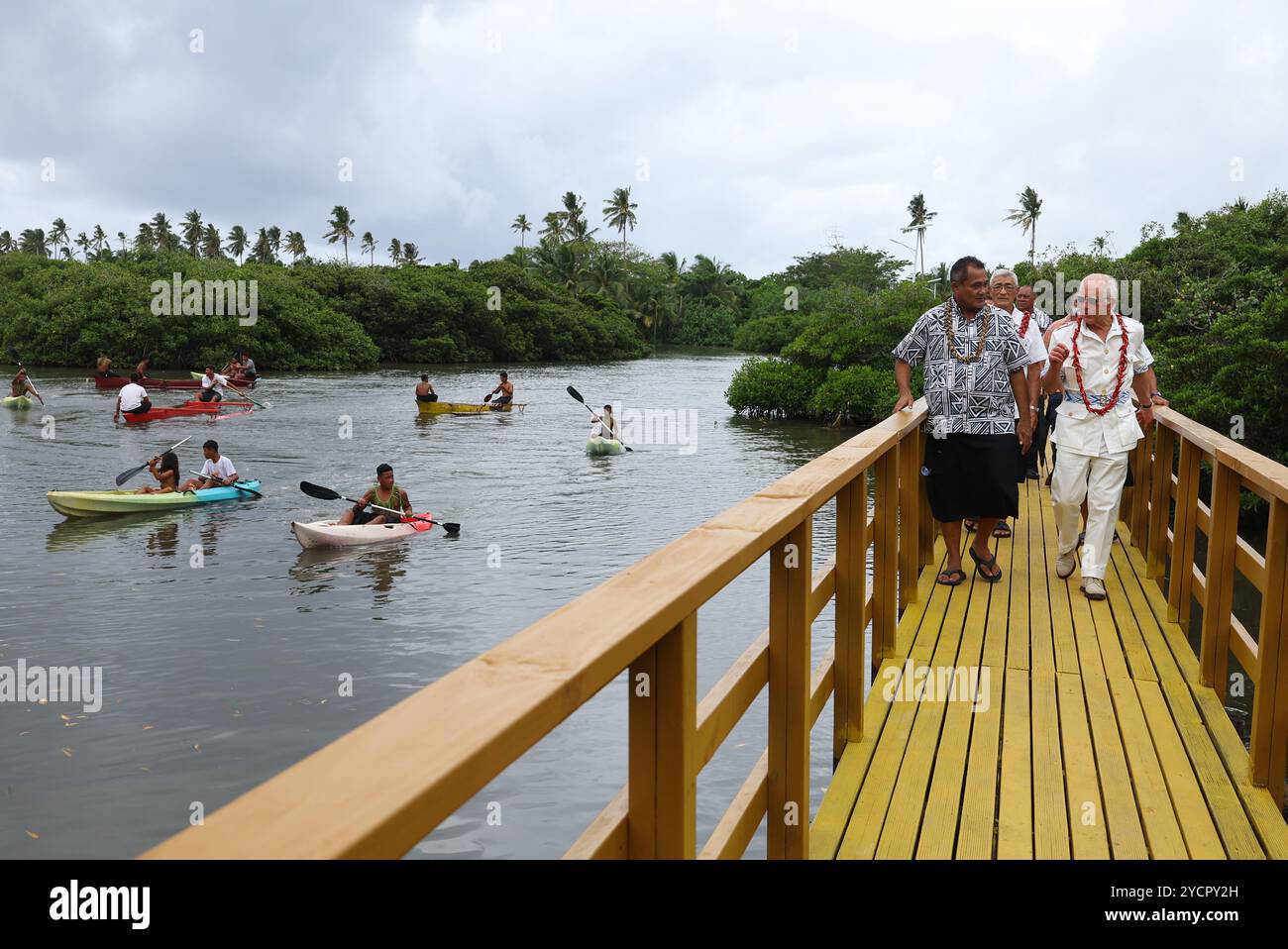 King Charles III and Minister Toeolesulusulu Cedric Schuster walk ...