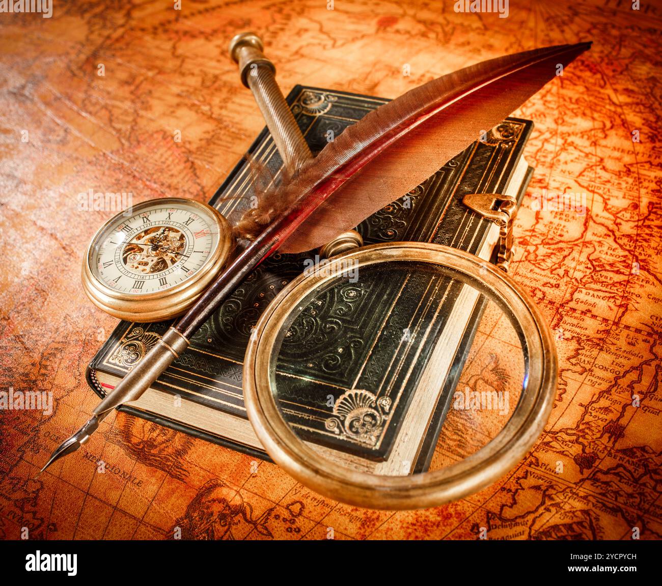 Vintage magnifying glass lies on an ancient world map Stock Photo - Alamy