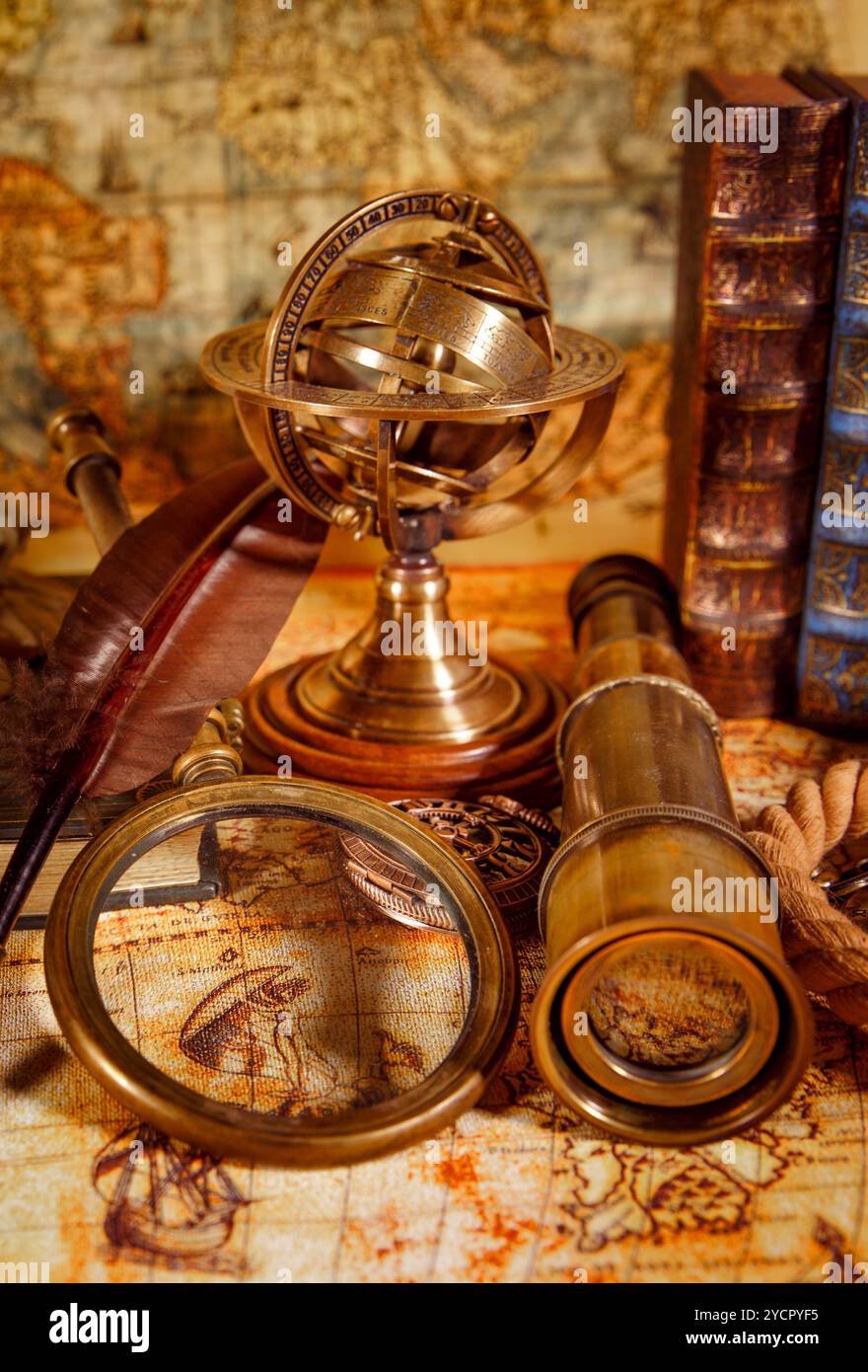 Vintage magnifying glass lies on an ancient world map Stock Photo - Alamy