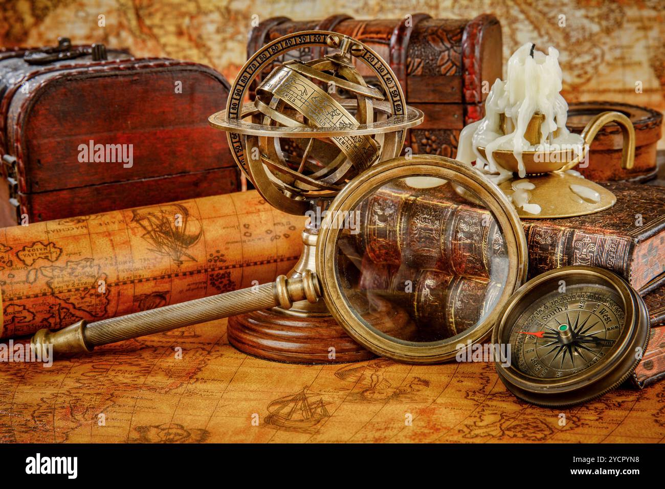 Vintage magnifying glass lies on an ancient world map Stock Photo - Alamy
