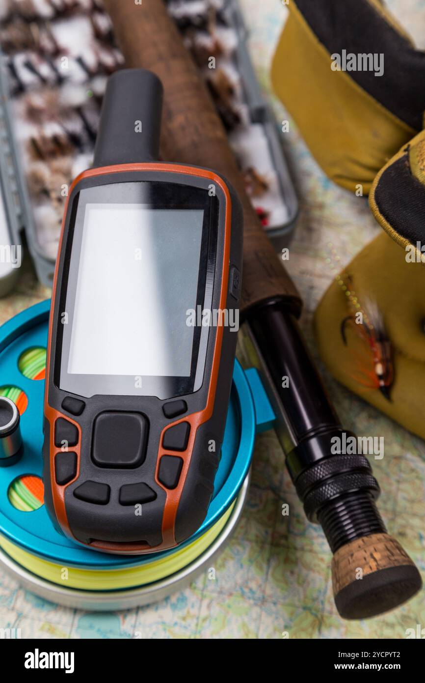 Gps navigator with fishing tackles on map Stock Photo - Alamy