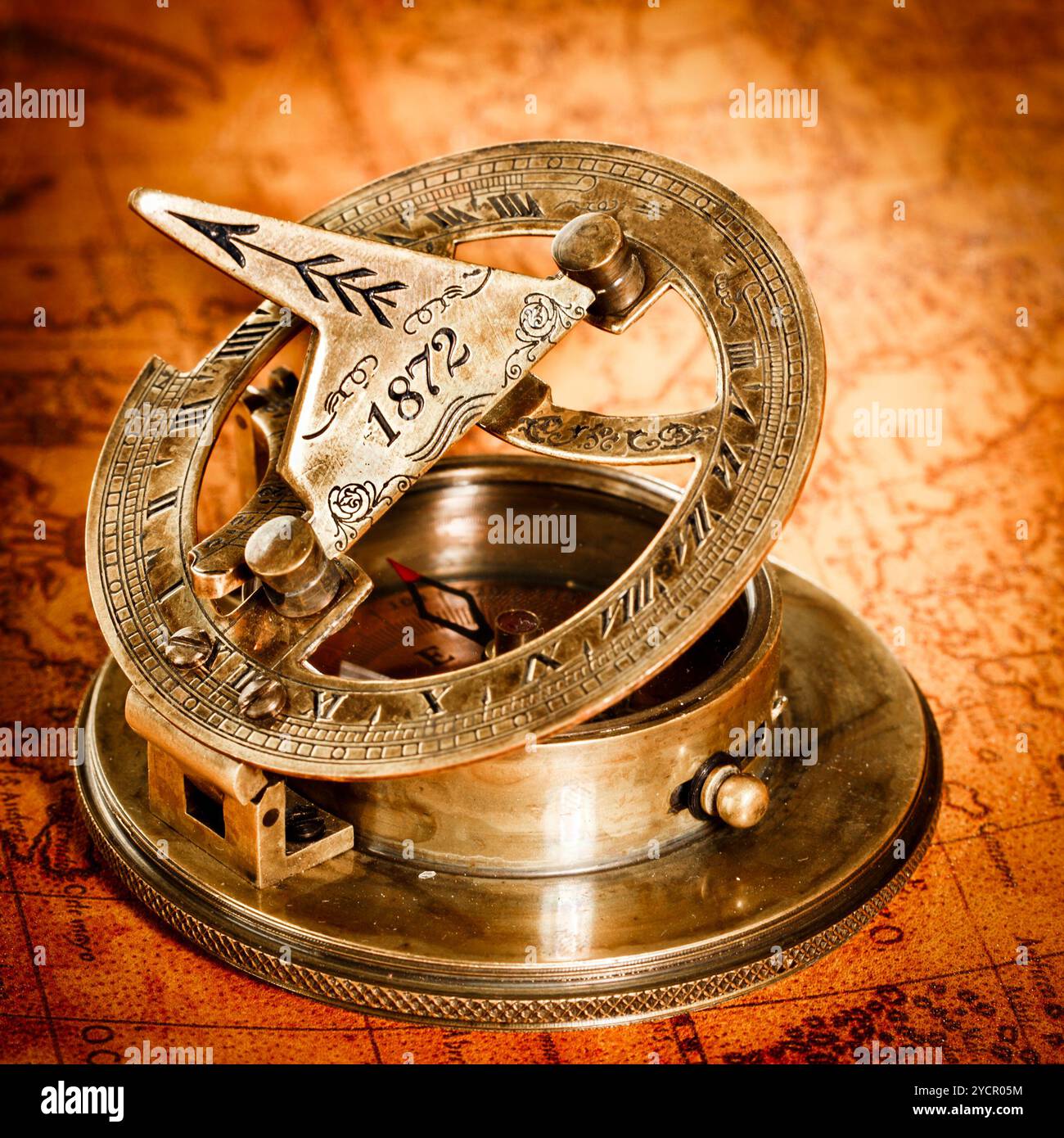 Vintage compass lies on an ancient world map Stock Photo - Alamy