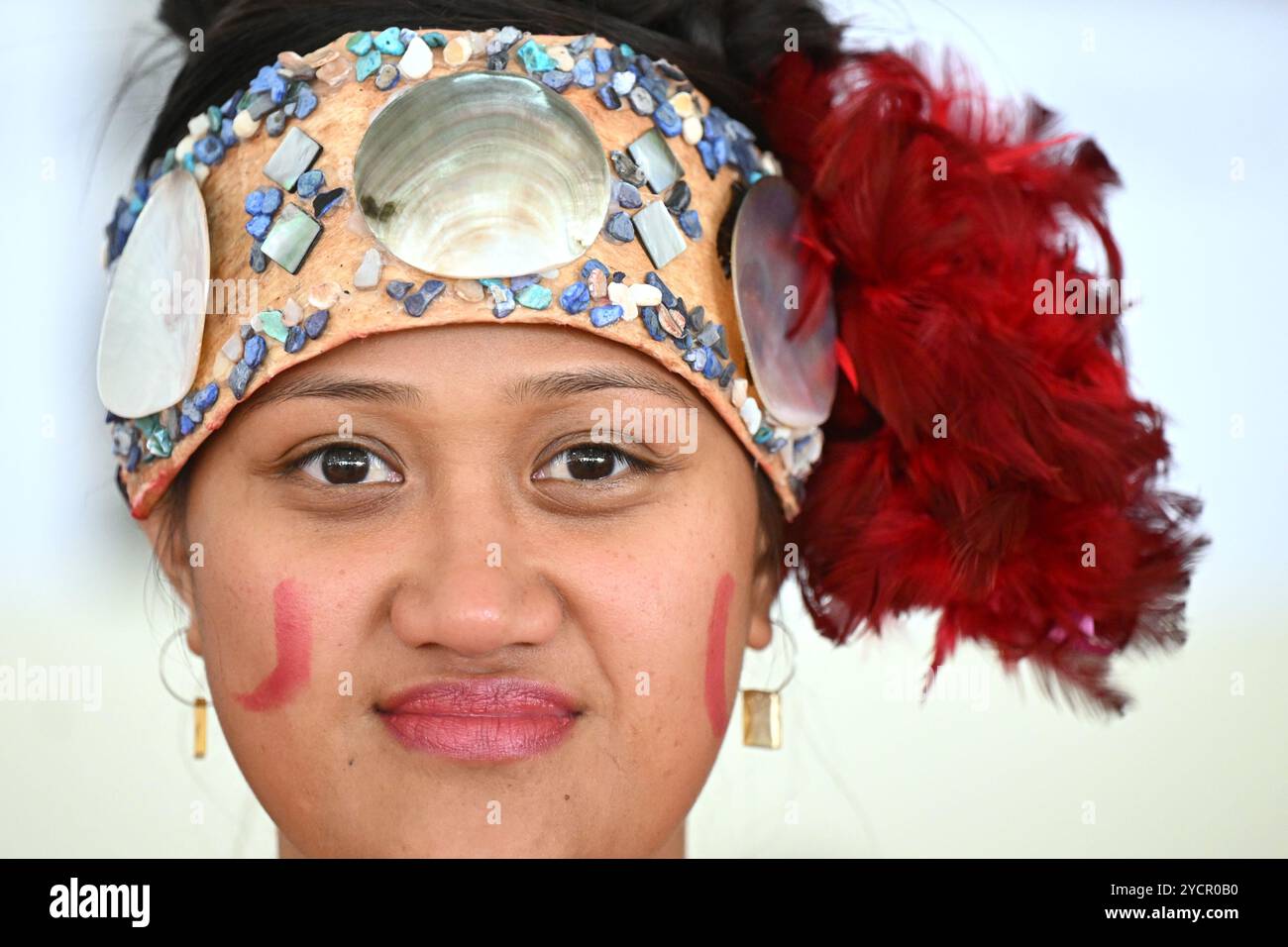A young girl waits for King Charles III and Queen Camilla to arrive for ...