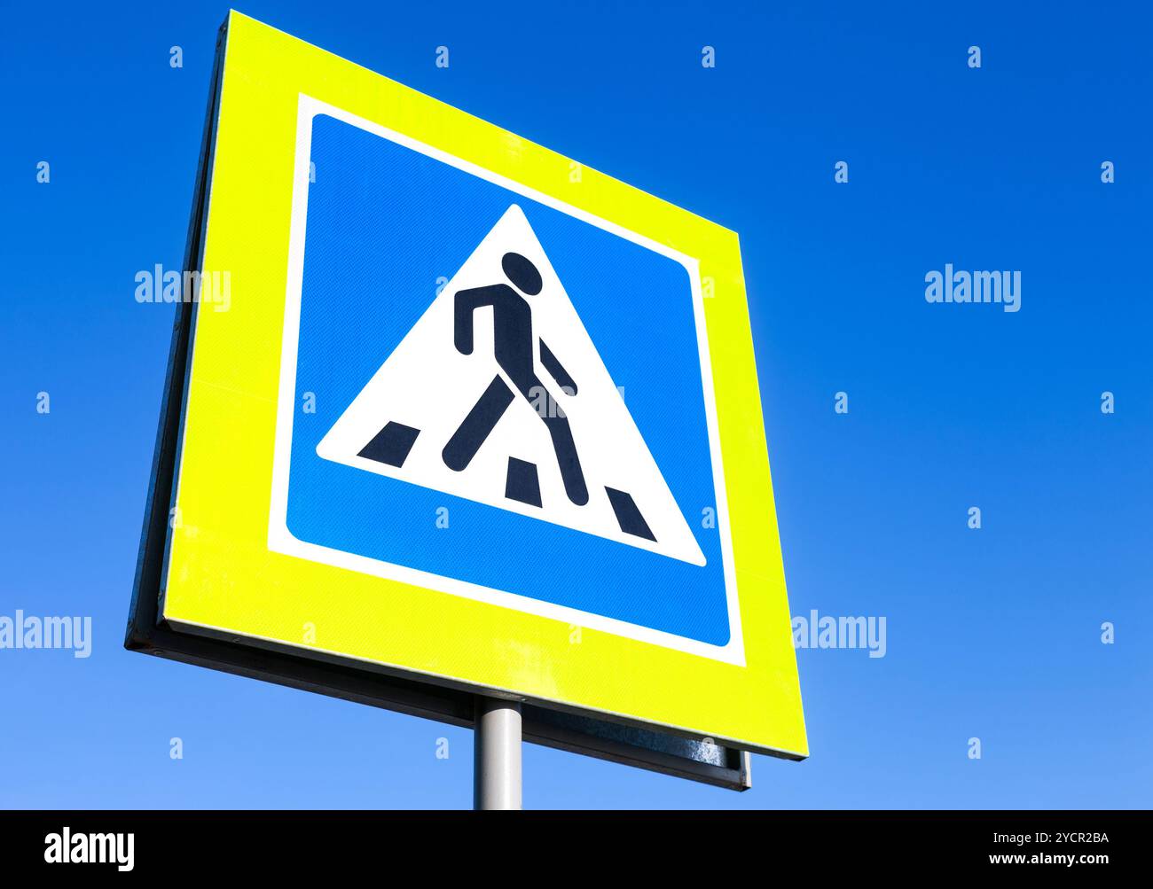 Traffic sign pedestrian crossing with blue sky in background Stock ...