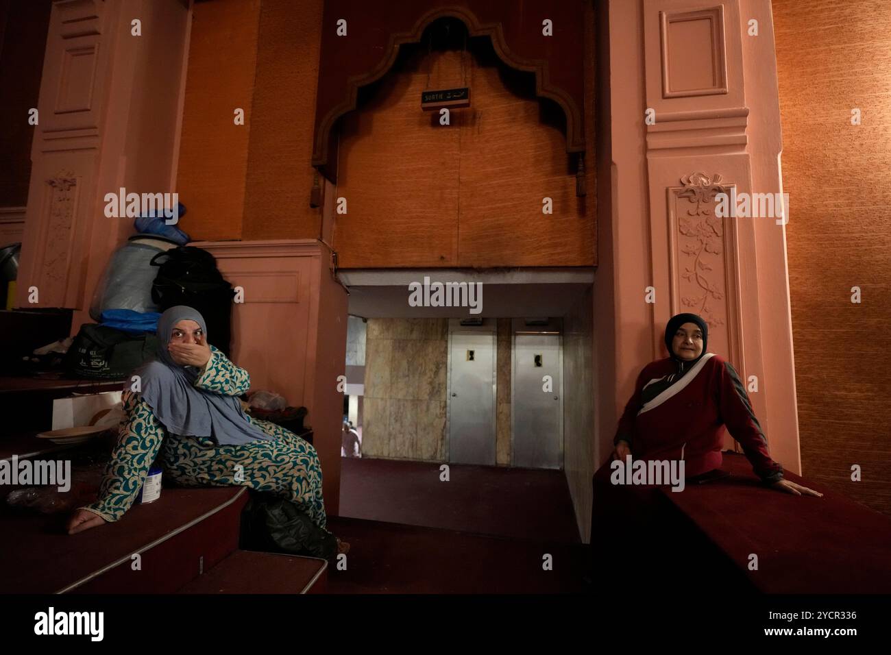 Mona Hanafi, left, and Joumana Hanafi, right, who fled the ongoing ...