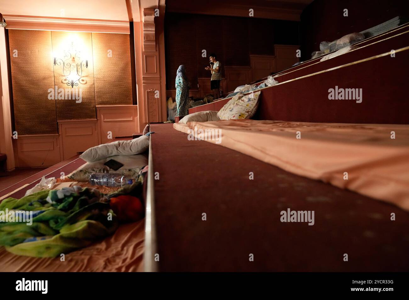 Mona Hanafi, left, a Lebanese woman who fled the ongoing Hezbollah ...