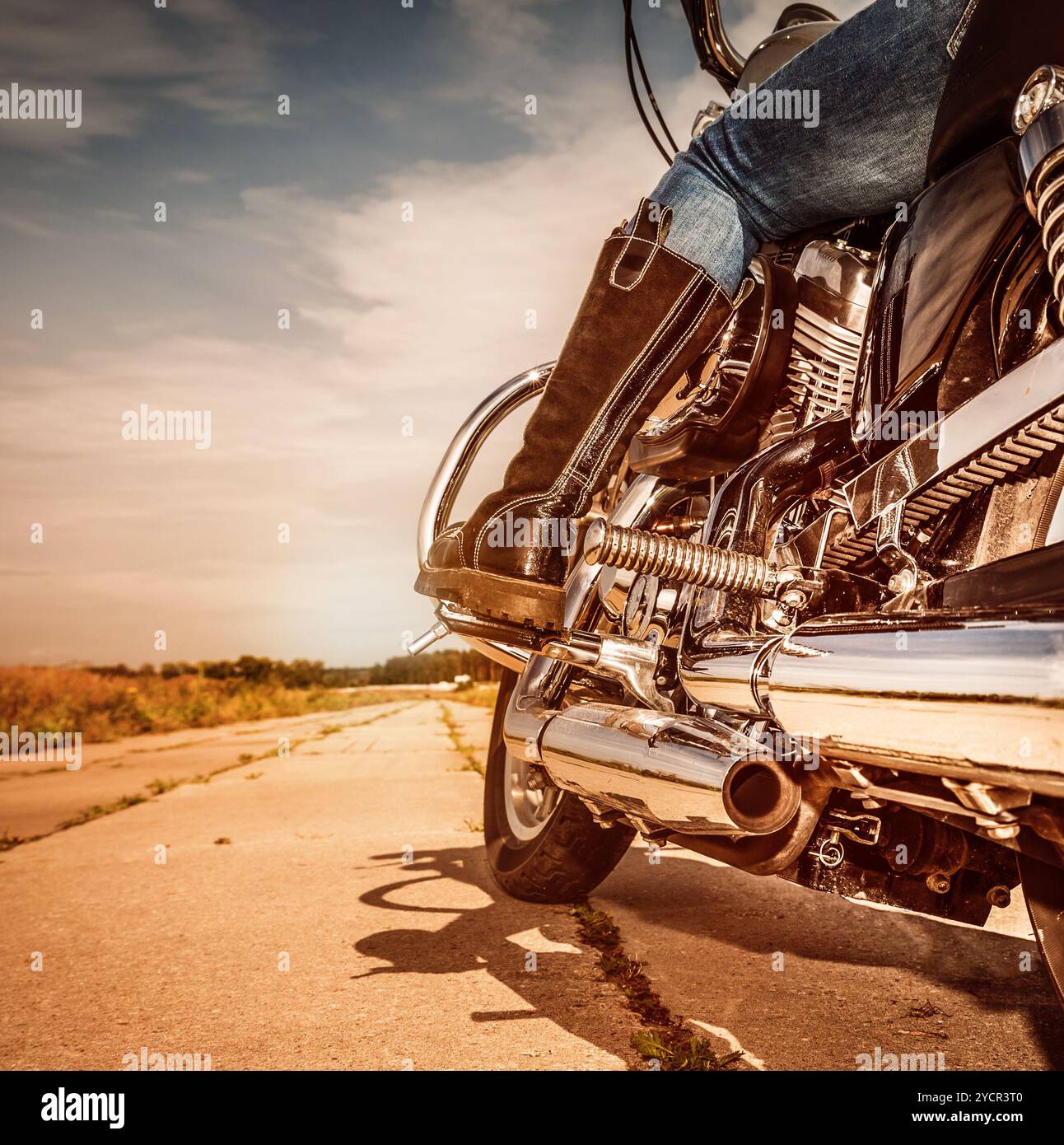 Biker girl riding on a motorcycle Stock Photo - Alamy