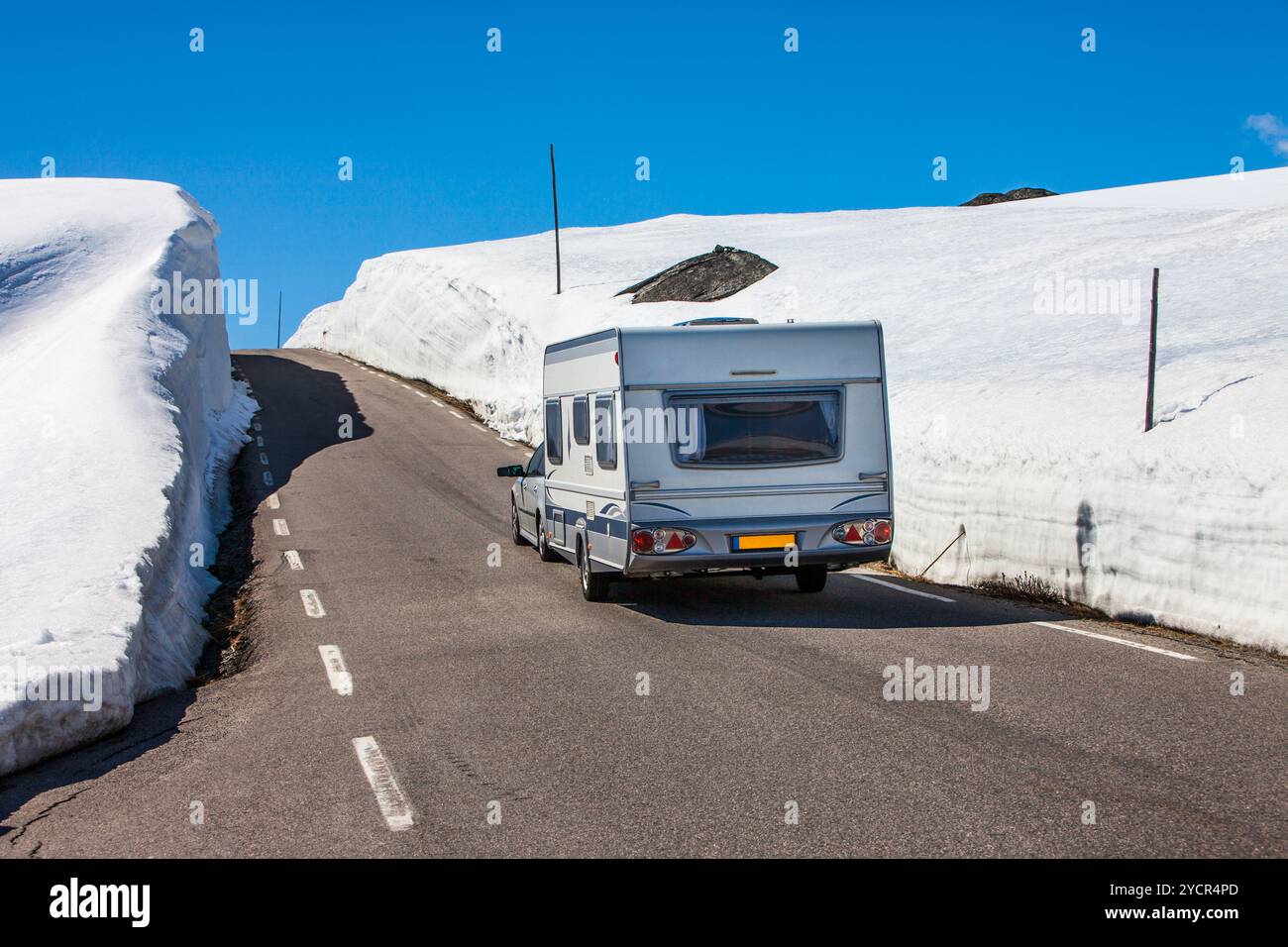 Caravan car travels on the highway Stock Photo - Alamy