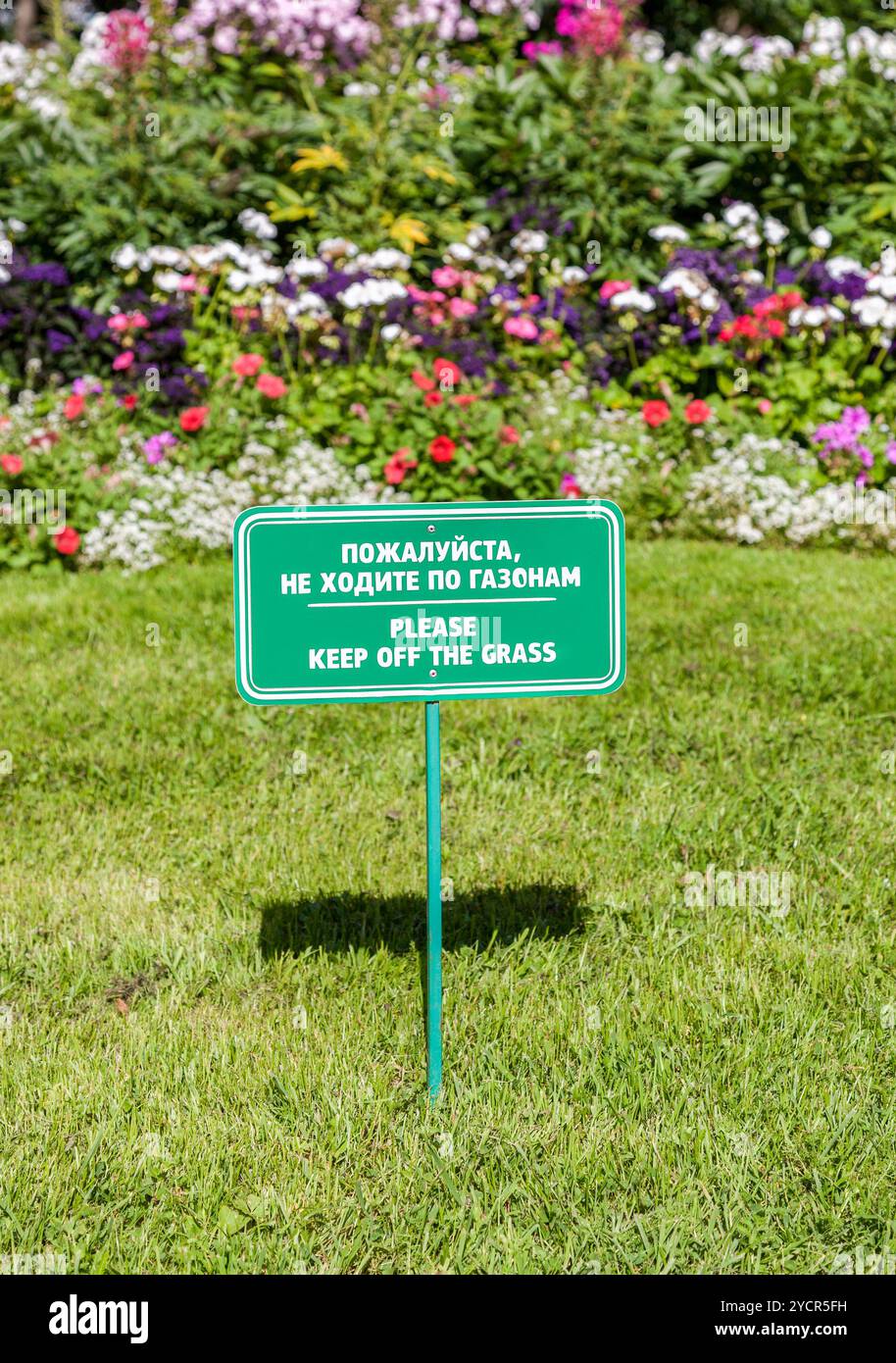 Notice board on the lawn with text Please keep of the grass Stock Photo ...