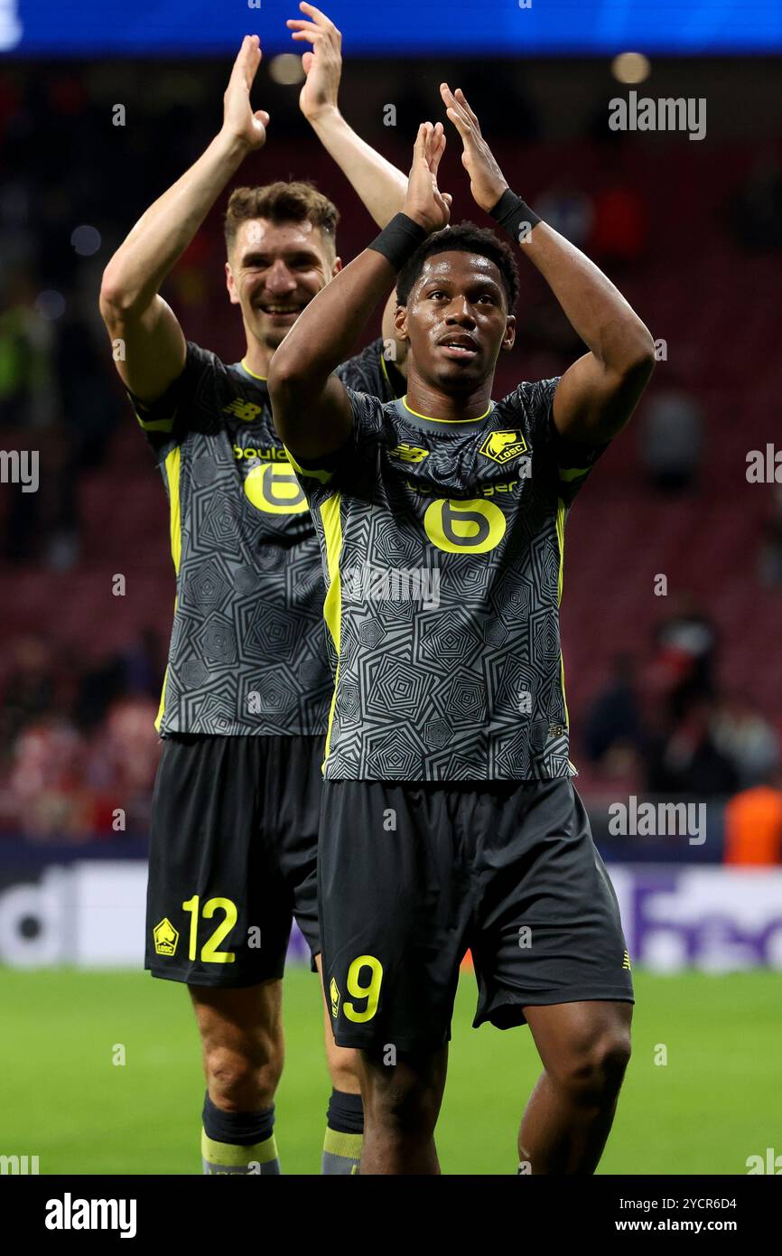 Madrid, Espagne. 23rd Oct, 2024. Jonathan David, left Thomas Meunier of ...