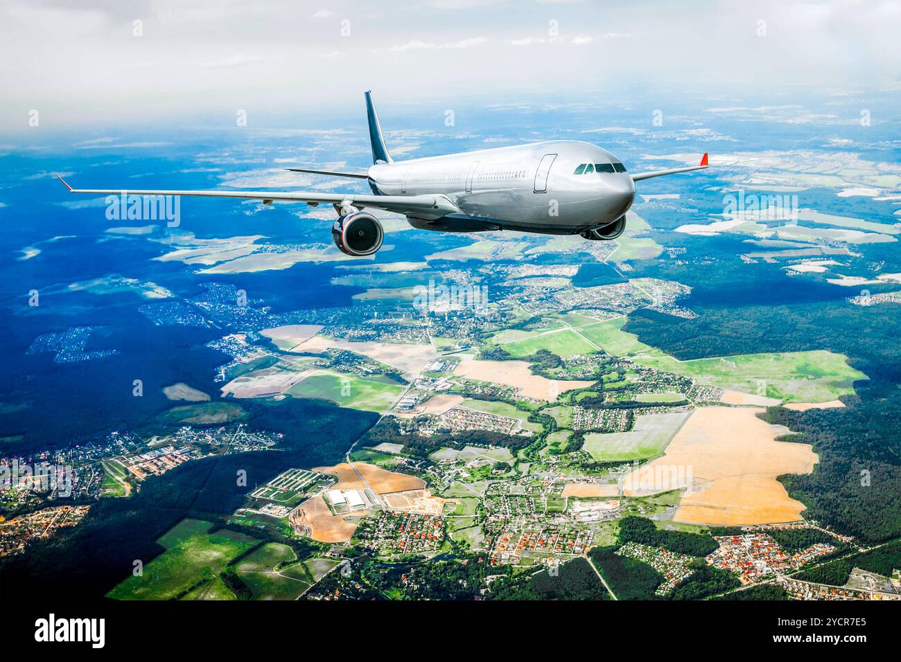 Passenger Airliner in the sky Stock Photo - Alamy
