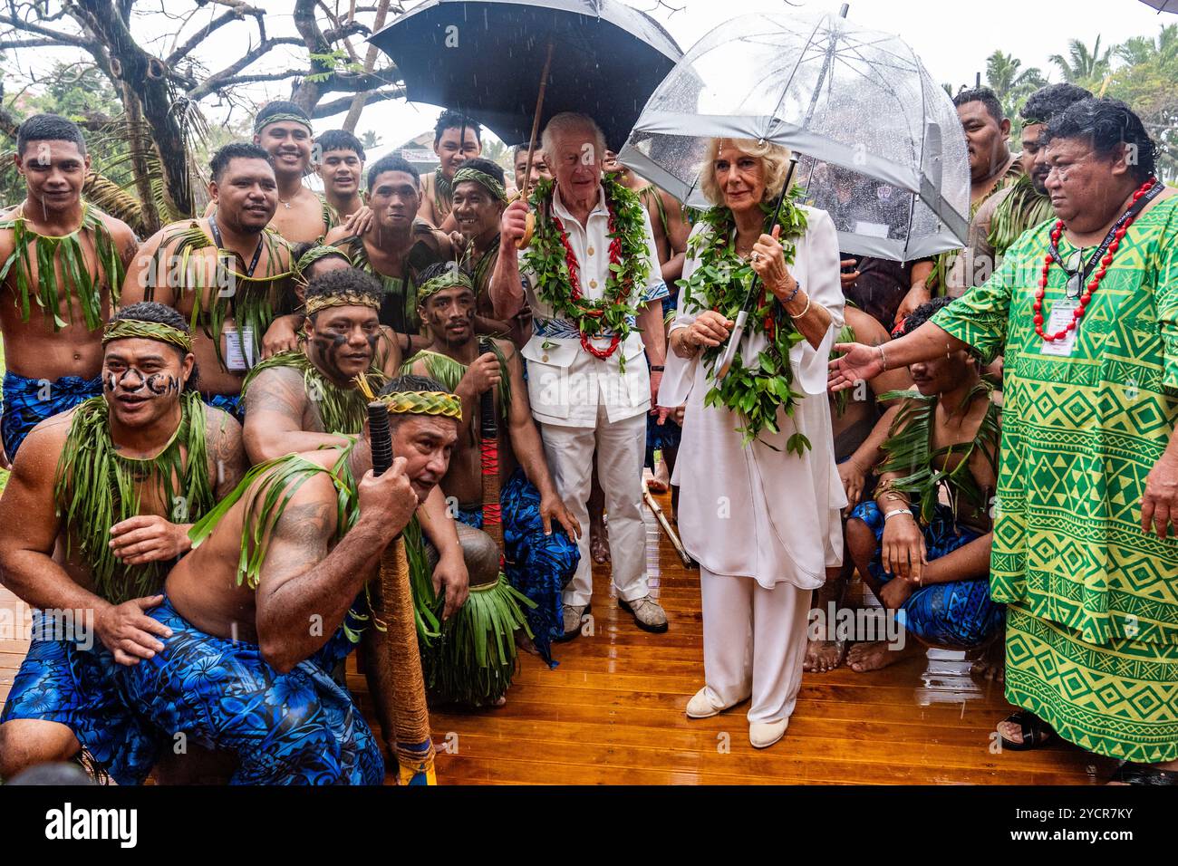 King Charles and Queen Camilla with members of a cricket team during a ...