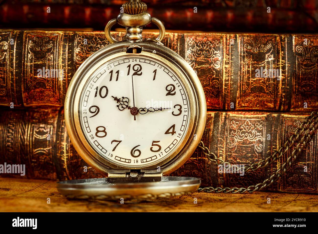 Old Books and Vintage pocket watch Stock Photo - Alamy