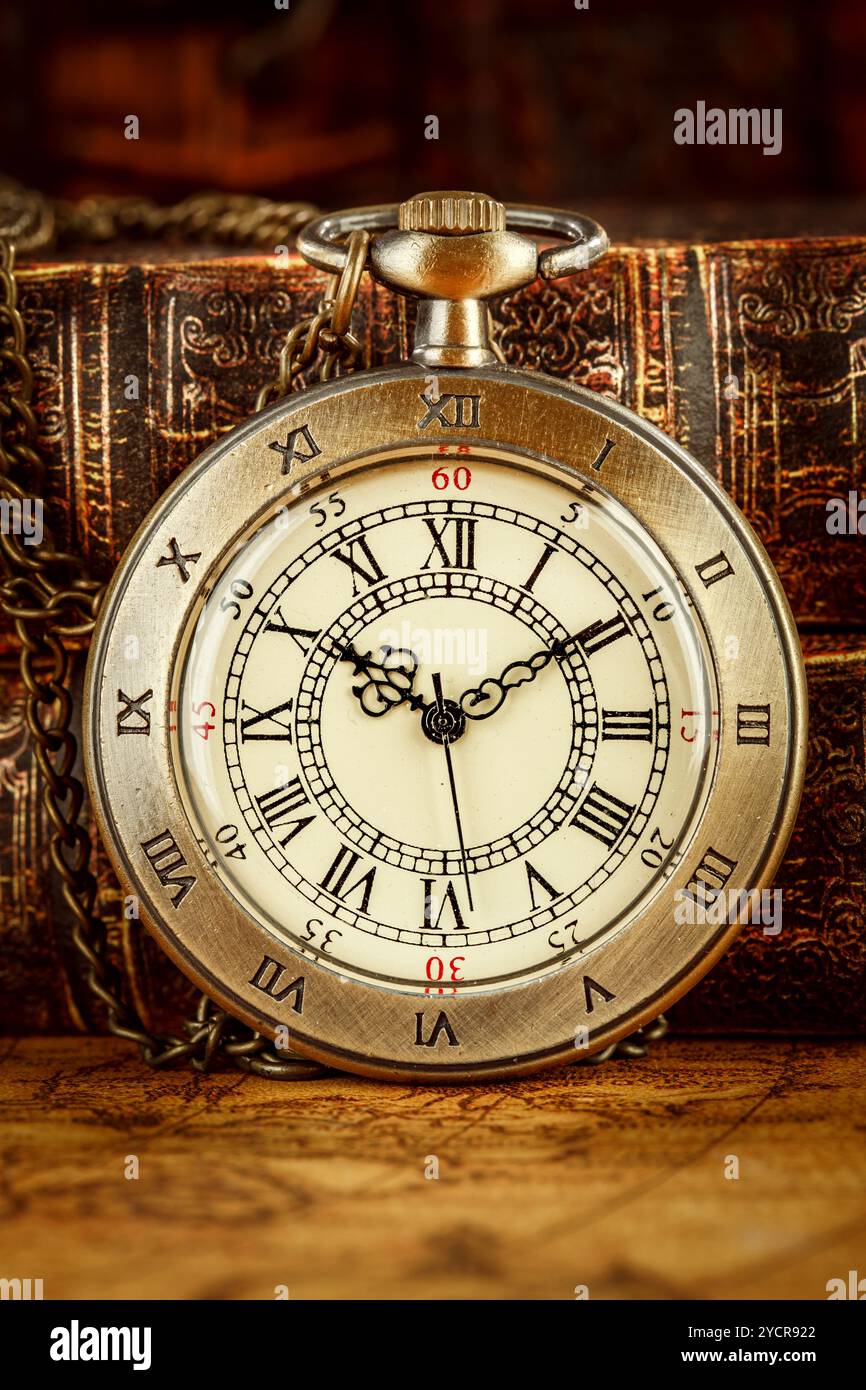 Old Books and Vintage pocket watch Stock Photo - Alamy