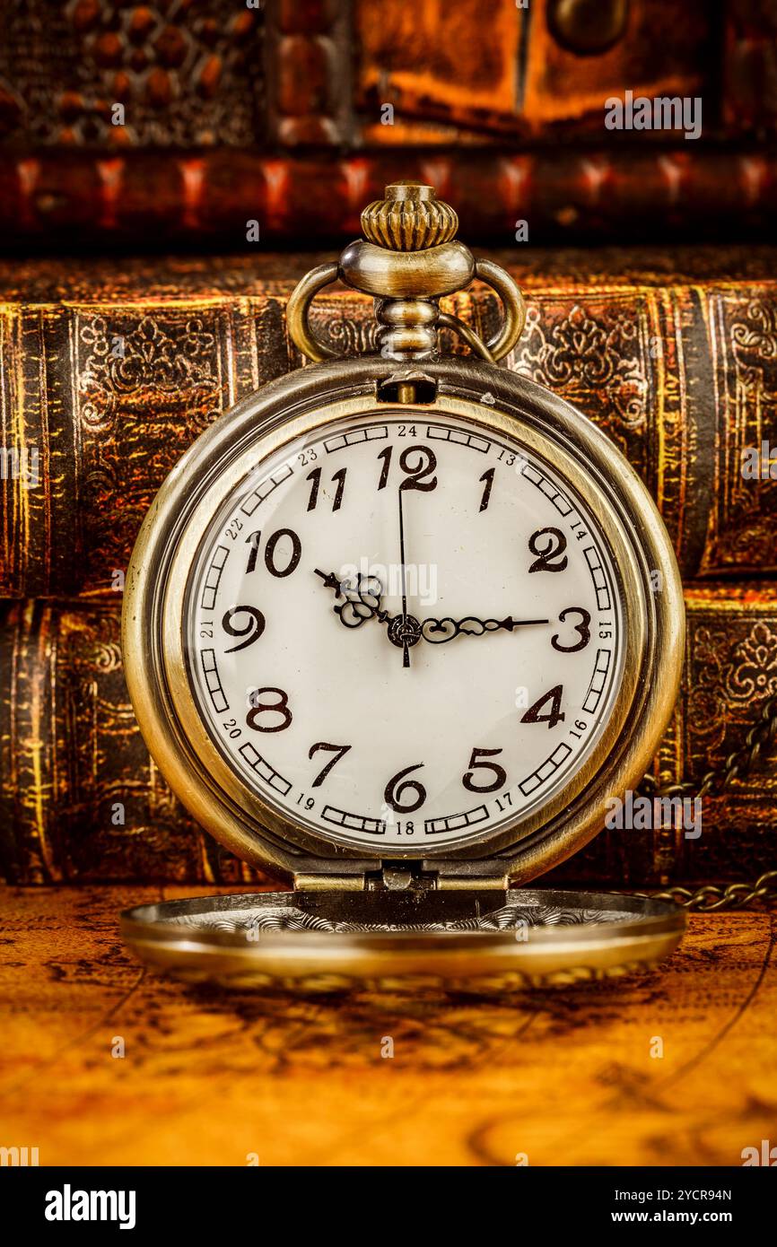 Old Books and Vintage pocket watch Stock Photo - Alamy