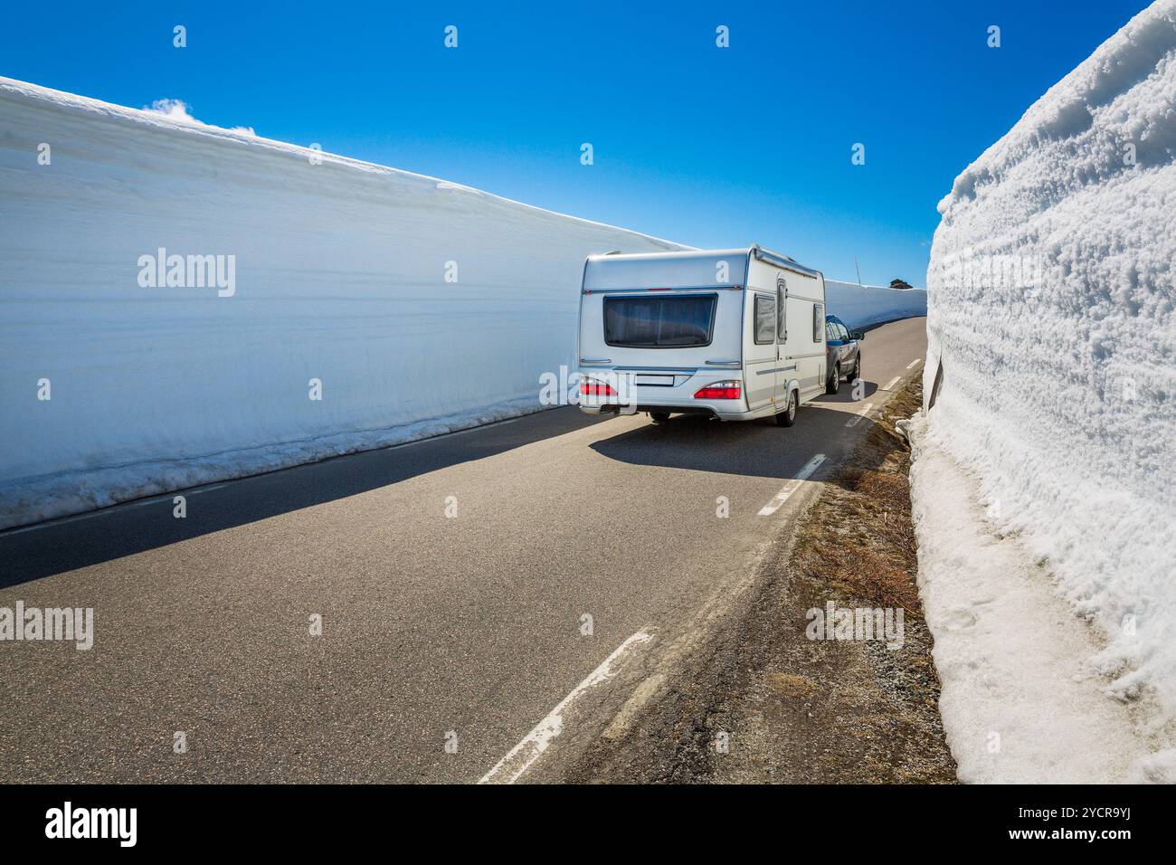 Caravan car travels on the highway Stock Photo - Alamy
