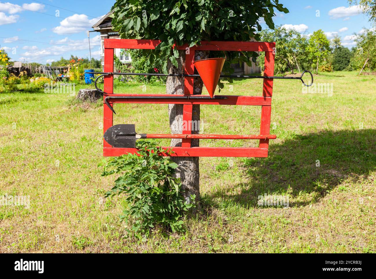 Firefighter shield with fire extinguishing tools in Russian village ...