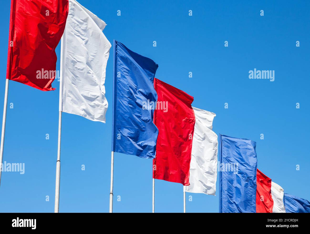 White, red and blue flags waving on the blue sky background Stock Photo ...