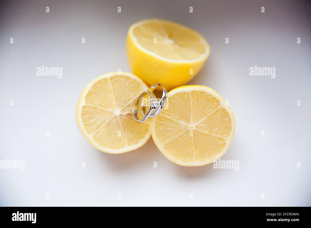 Lemon with wedding rings Stock Photo - Alamy