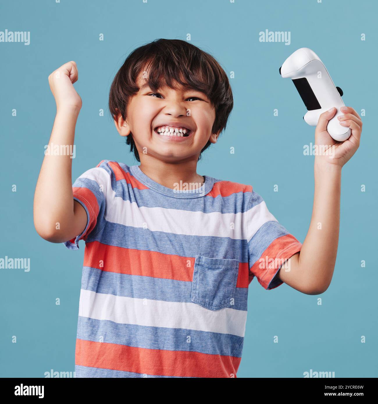 Boy, controller and gamer portrait for celebration in studio, winner ...