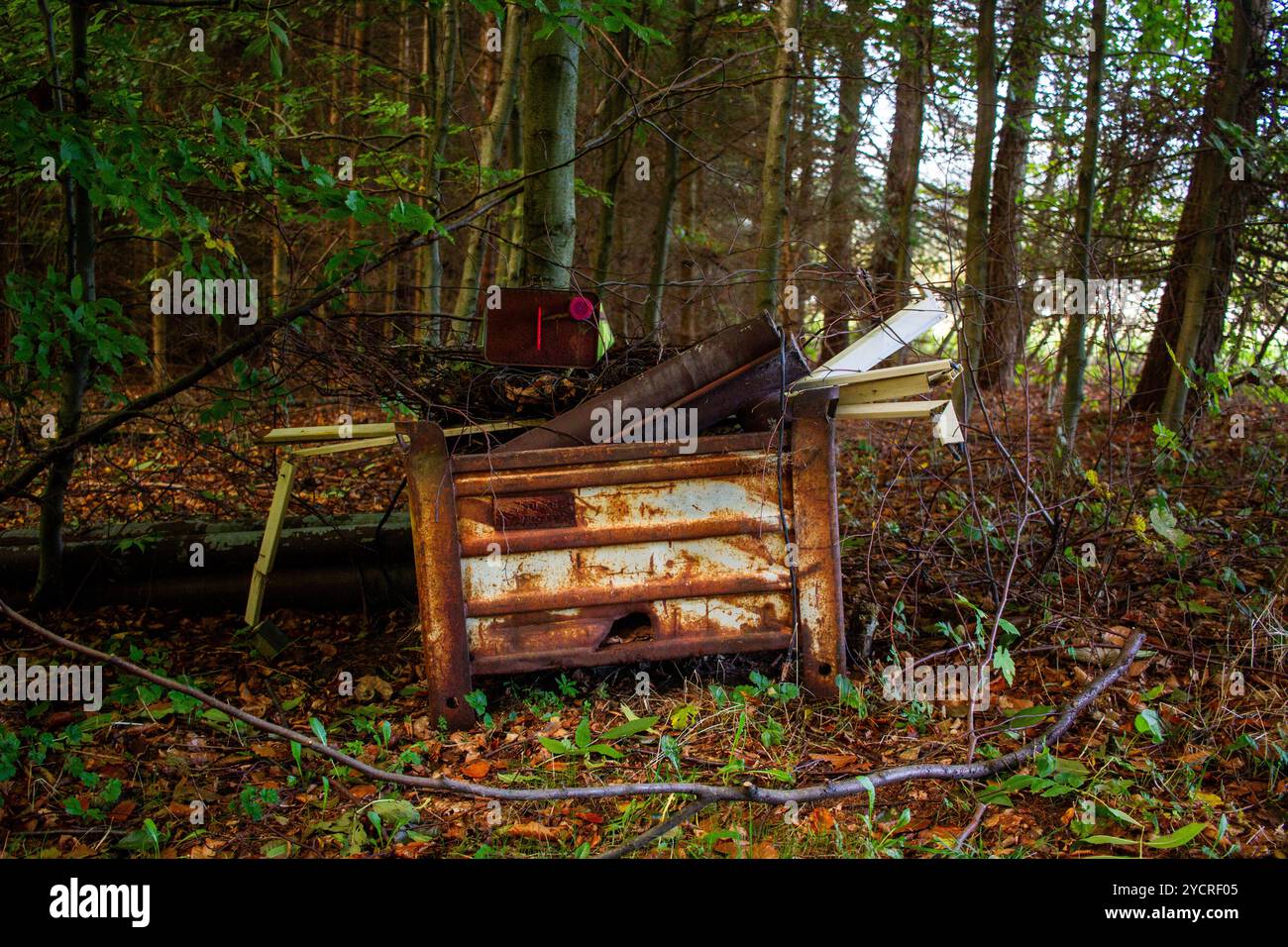 Industrial waste and rubbish black stored in a forest, forbidden dump ...