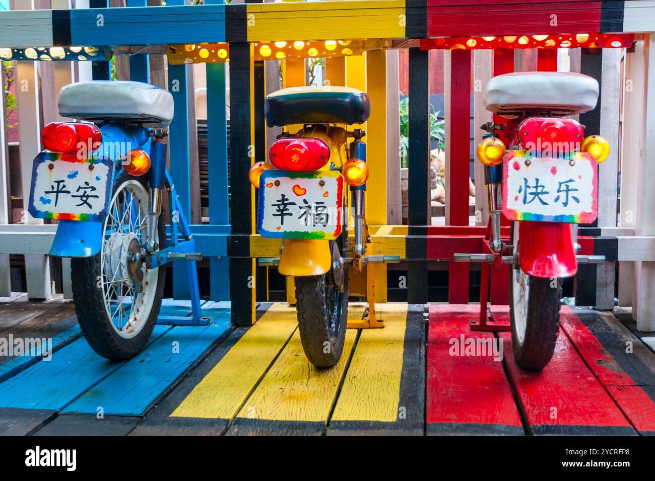 Three back seat of motorbikes Stock Photo - Alamy