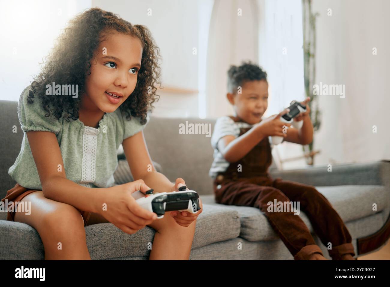 Smile, controllers and children on sofa with video game for bonding ...