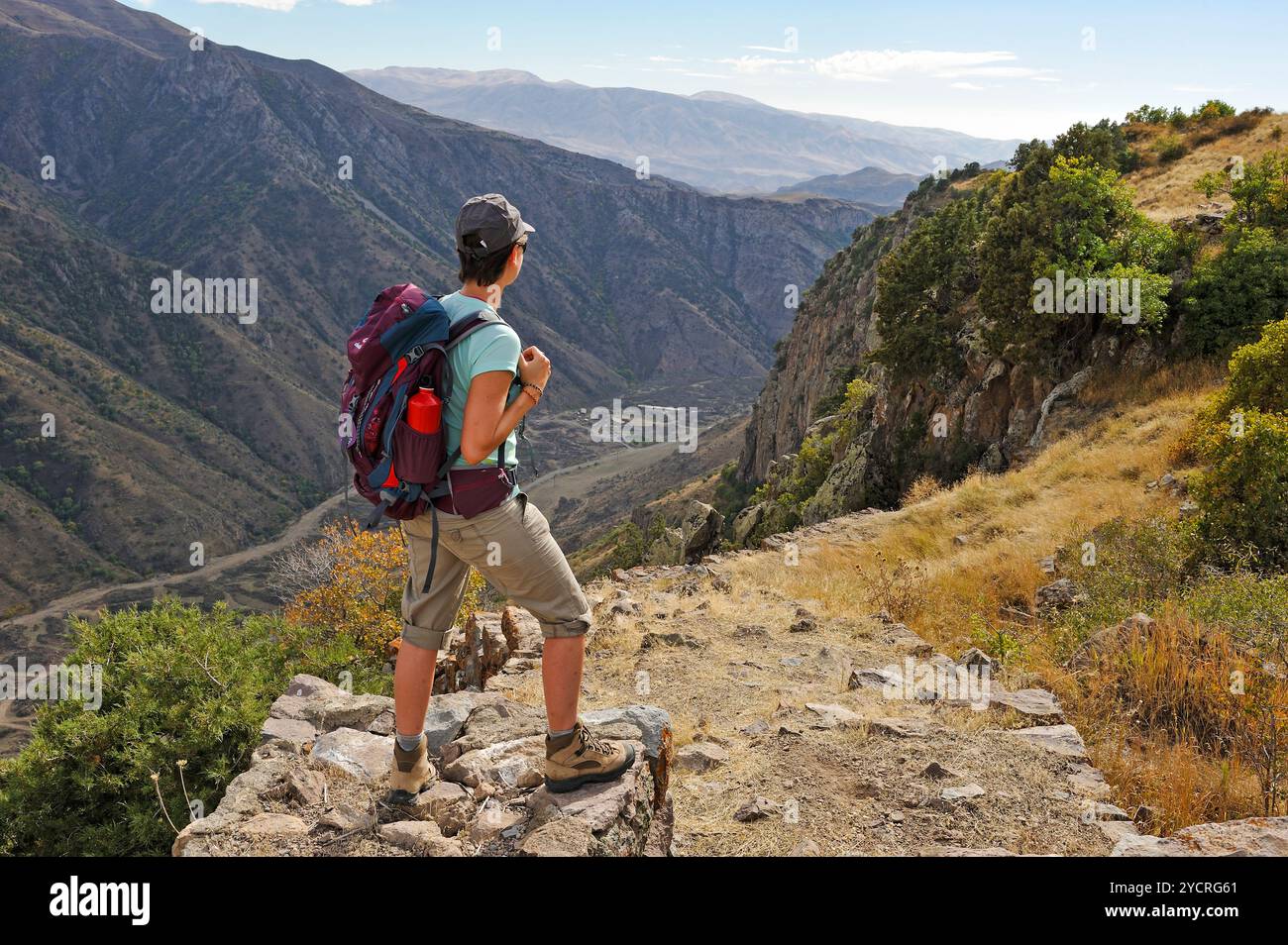 Woman walking between doors hi-res stock photography and images - Alamy
