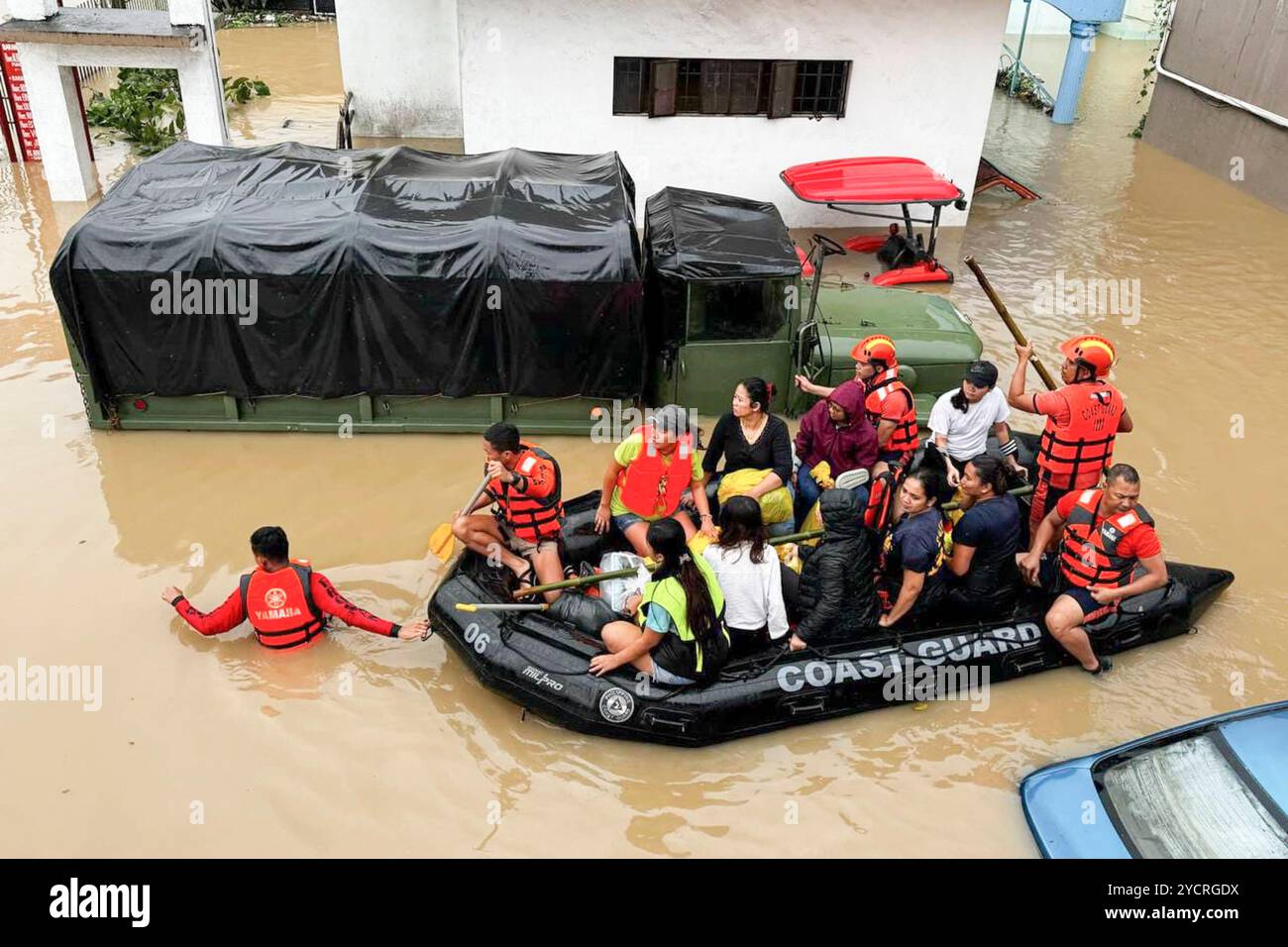 In this photo provided by the Philippine Coast Guard, rescuers ferry ...
