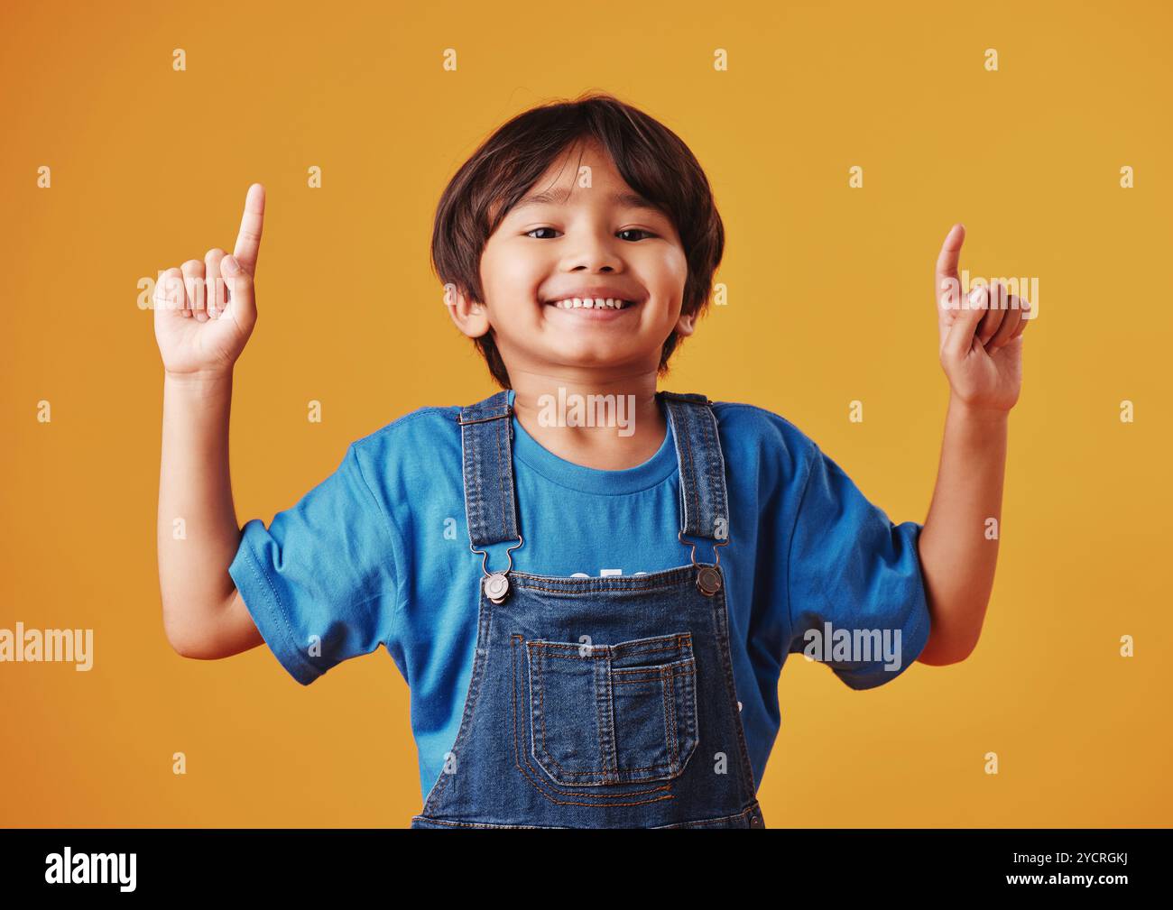 Japanese kid, boy and pointing in studio background for fashion with ...
