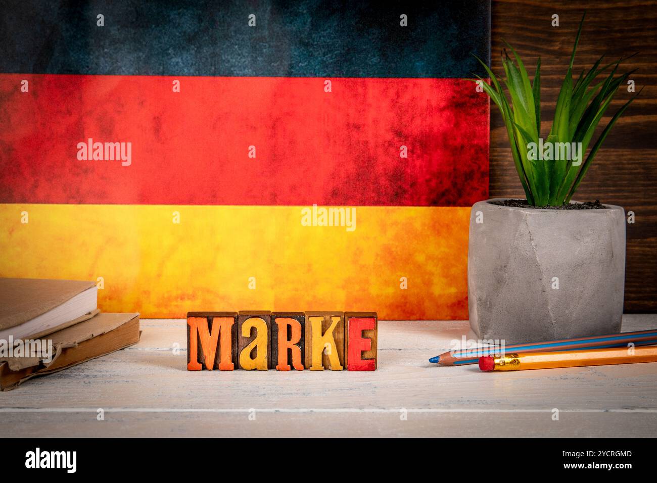 BRAND. Text in German. Alphabet blocks on a white painted wooden ...