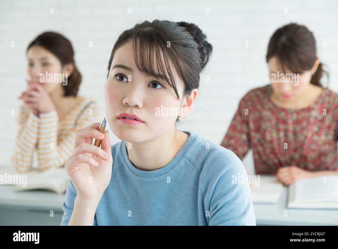 Female university students taking classes Stock Photo - Alamy